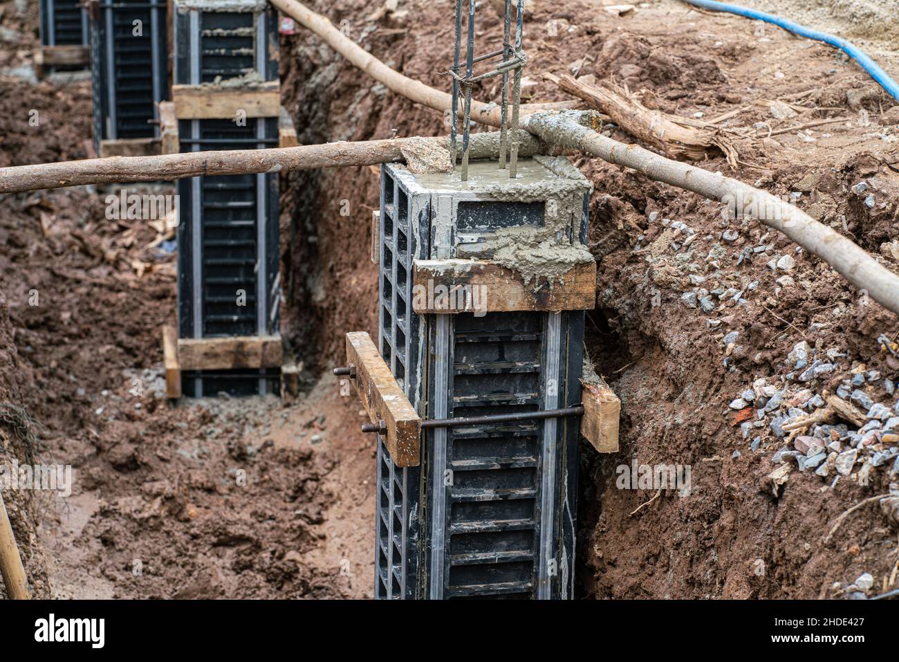 Cement concrete poll in construction site wall building new house ...