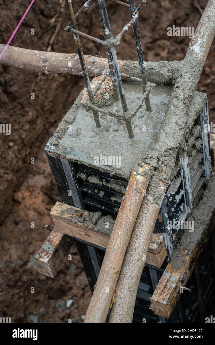 Cement concrete poll in construction site wall building new house ...