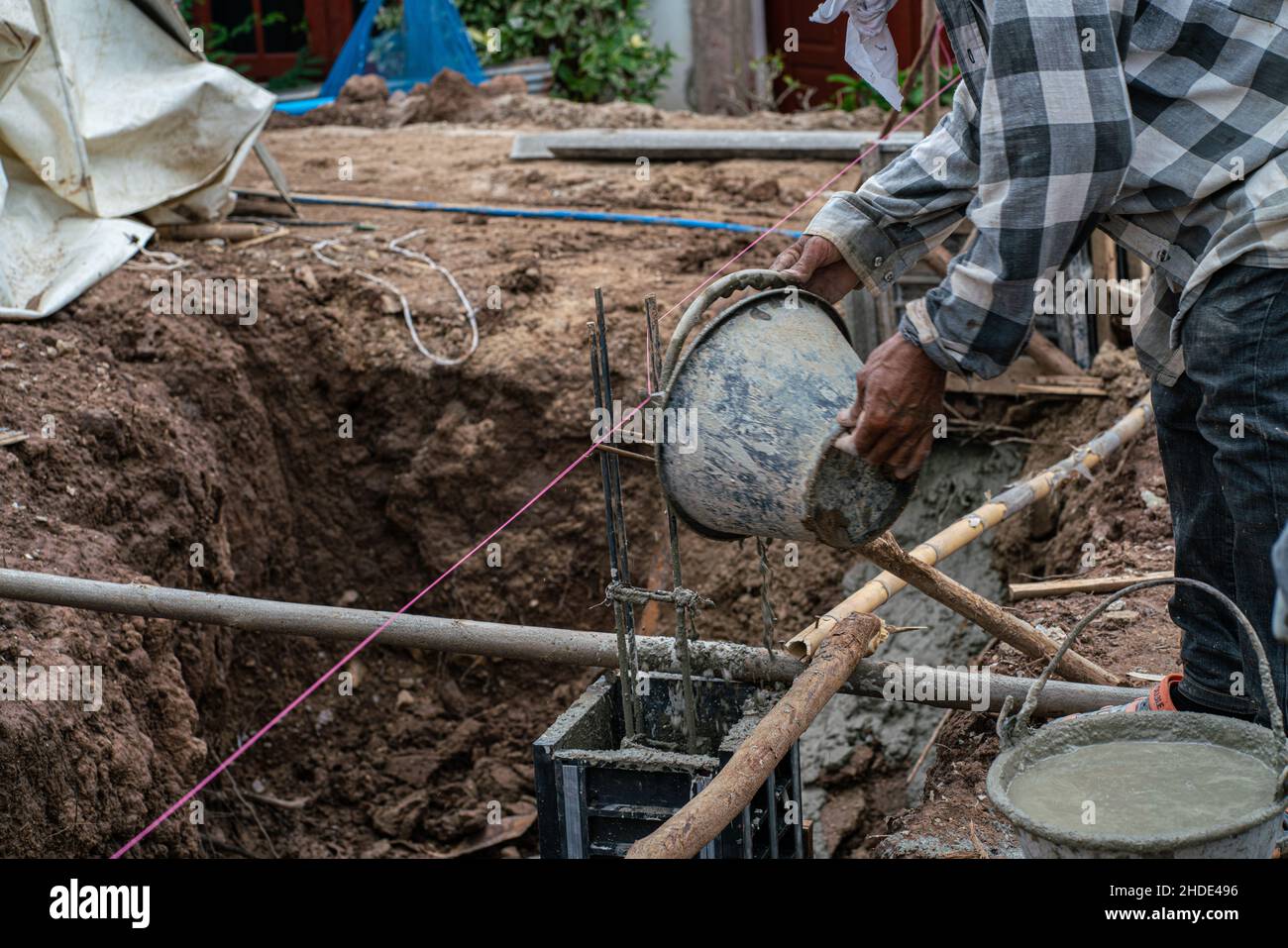 Cement concrete poll in construction site wall building new house ...