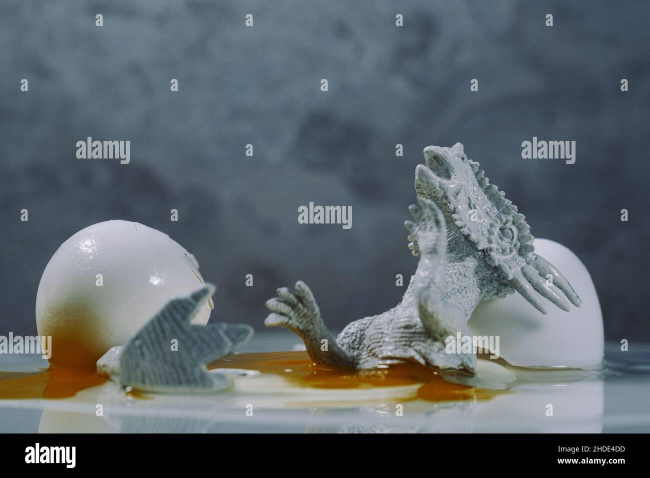 Creepy abstract hatched dead dinosaur egg with yoke concept Stock Photo ...