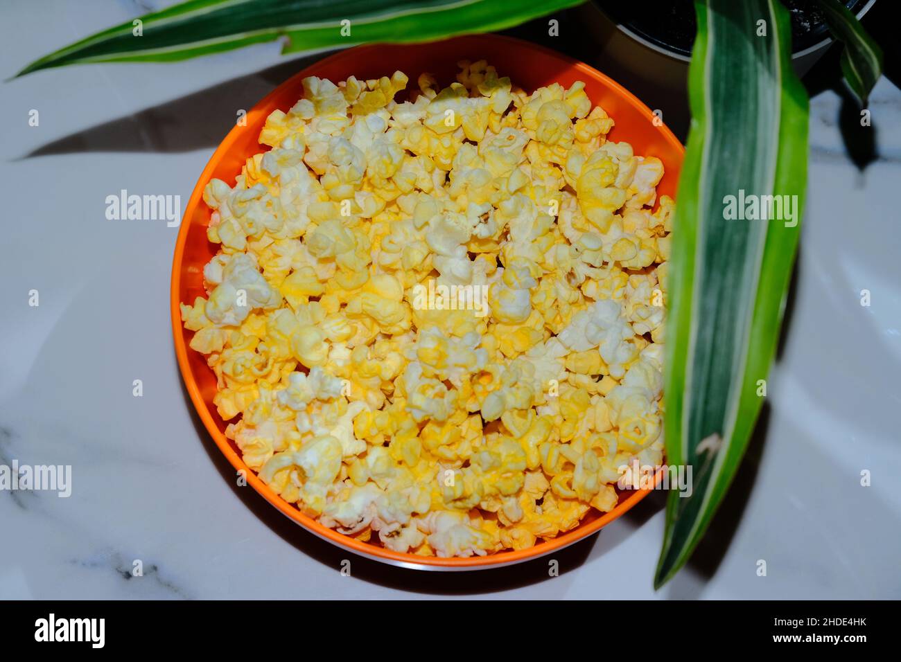 Homemade movie theater popcorn on kitchen counter using direct flash ...