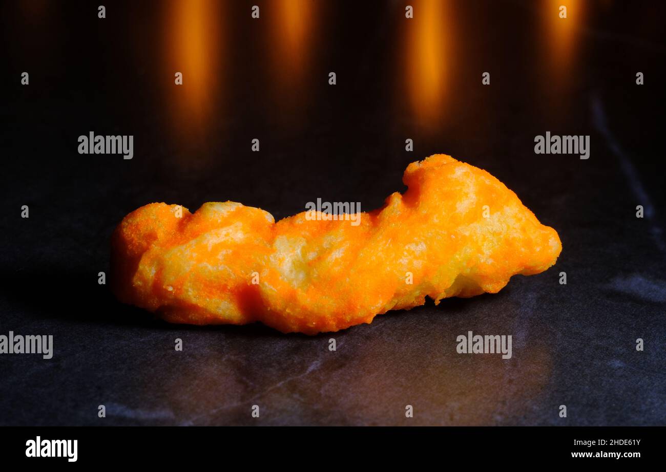 Cheese puff unhealthy junk food snack macro closeup Stock Photo - Alamy
