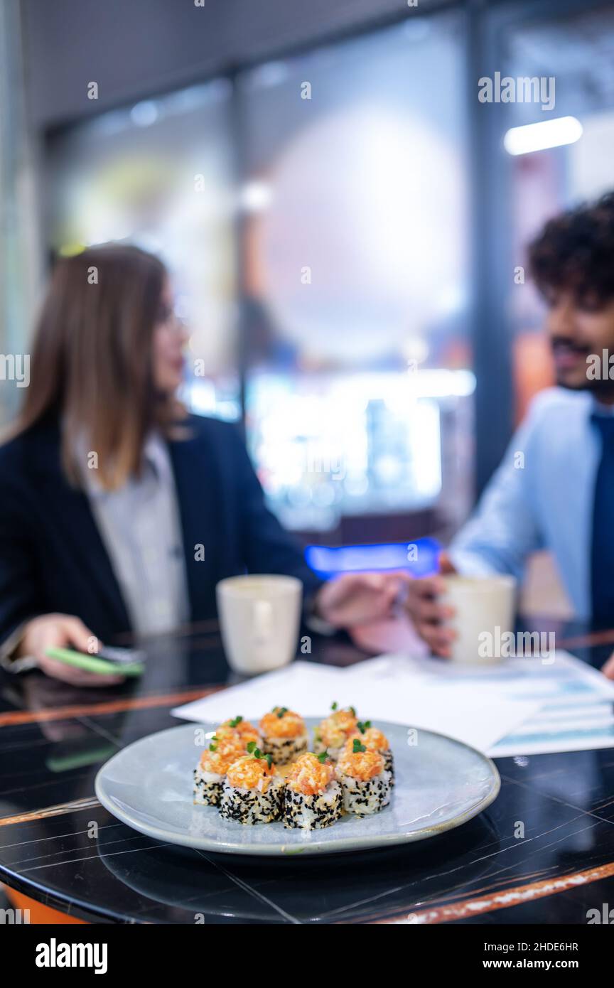 Colleagues having lunch and talking Stock Photo - Alamy
