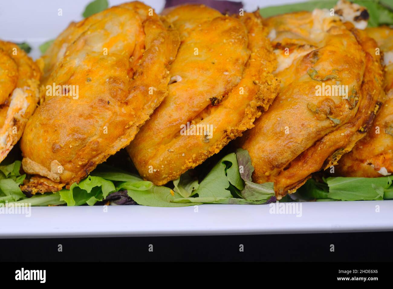 Mexican beef empanadas on display at local grocery market Stock Photo ...