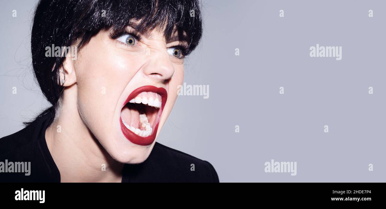 Woman shouting and screaming loud with open mouth. Human emotions ...