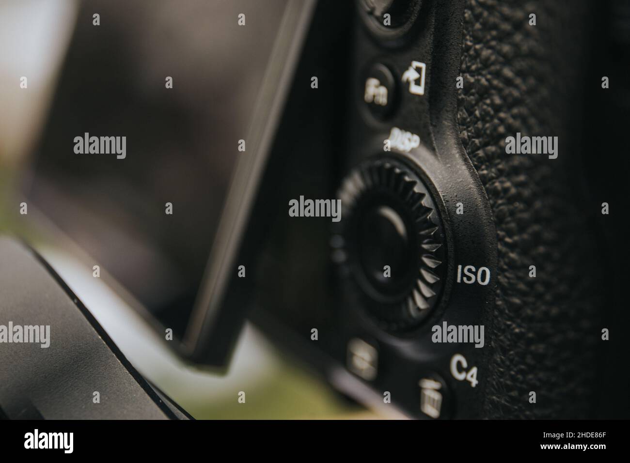 Selective focus shot of iso button of a digital camera with flip screen ...
