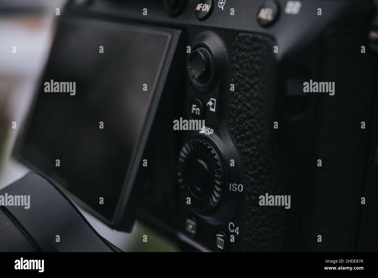 Selective focus shot of iso button of a digital camera with flip screen ...