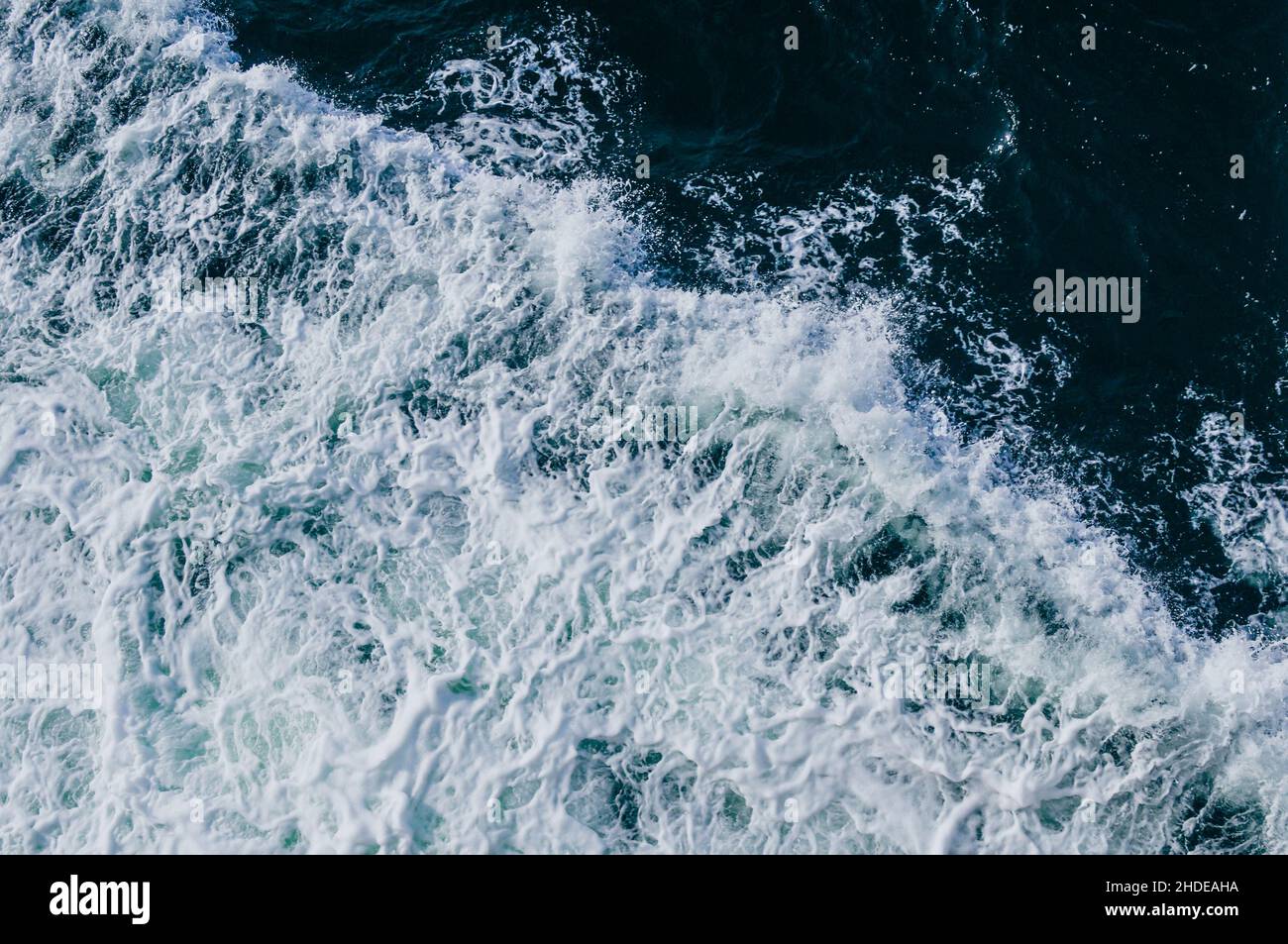 Aerial view of foam transparentwater with waves in the sea Stock Photo ...