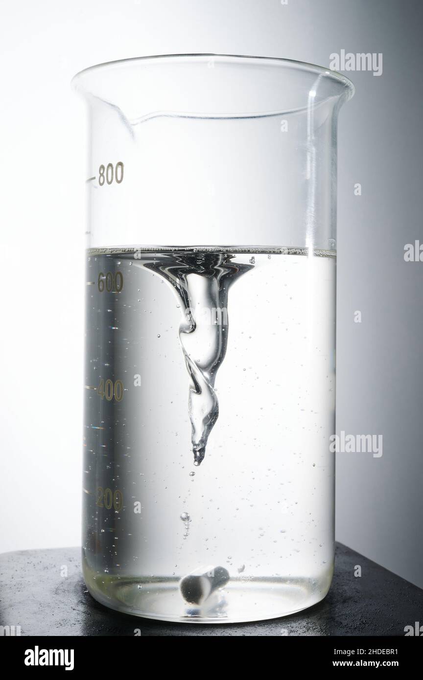 Laboratory flask with transparent liquid and magnet mixer Stock Photo ...