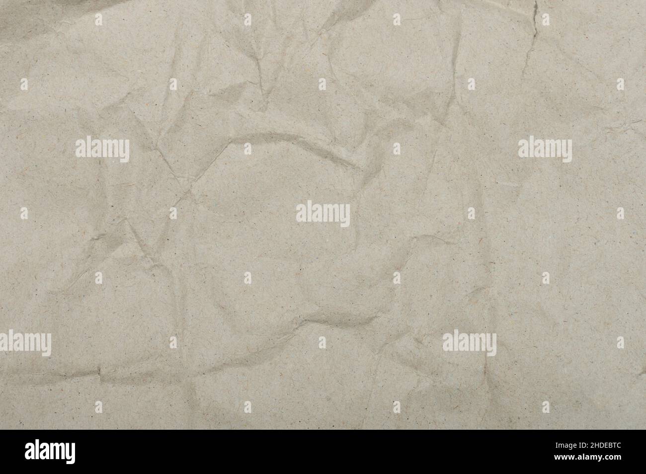 Old crumpled beige color paper background macro close up view Stock ...