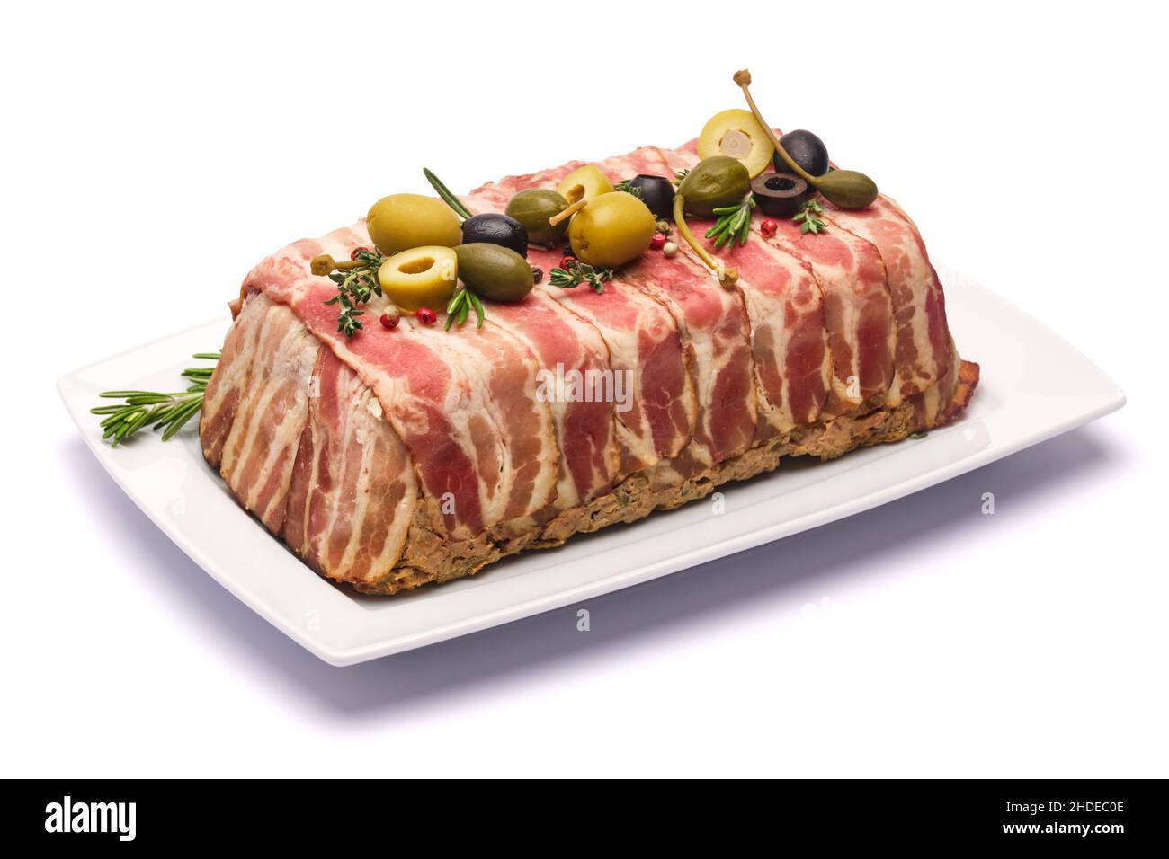 Traditional French terrine covered with bacon isolated on white ...