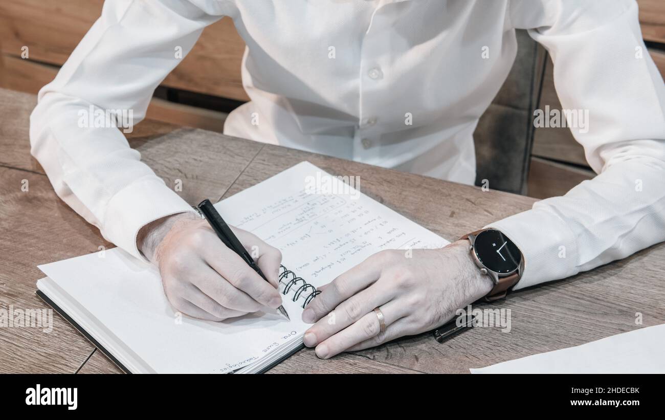 Businessman signs documents hi-res stock photography and images - Alamy