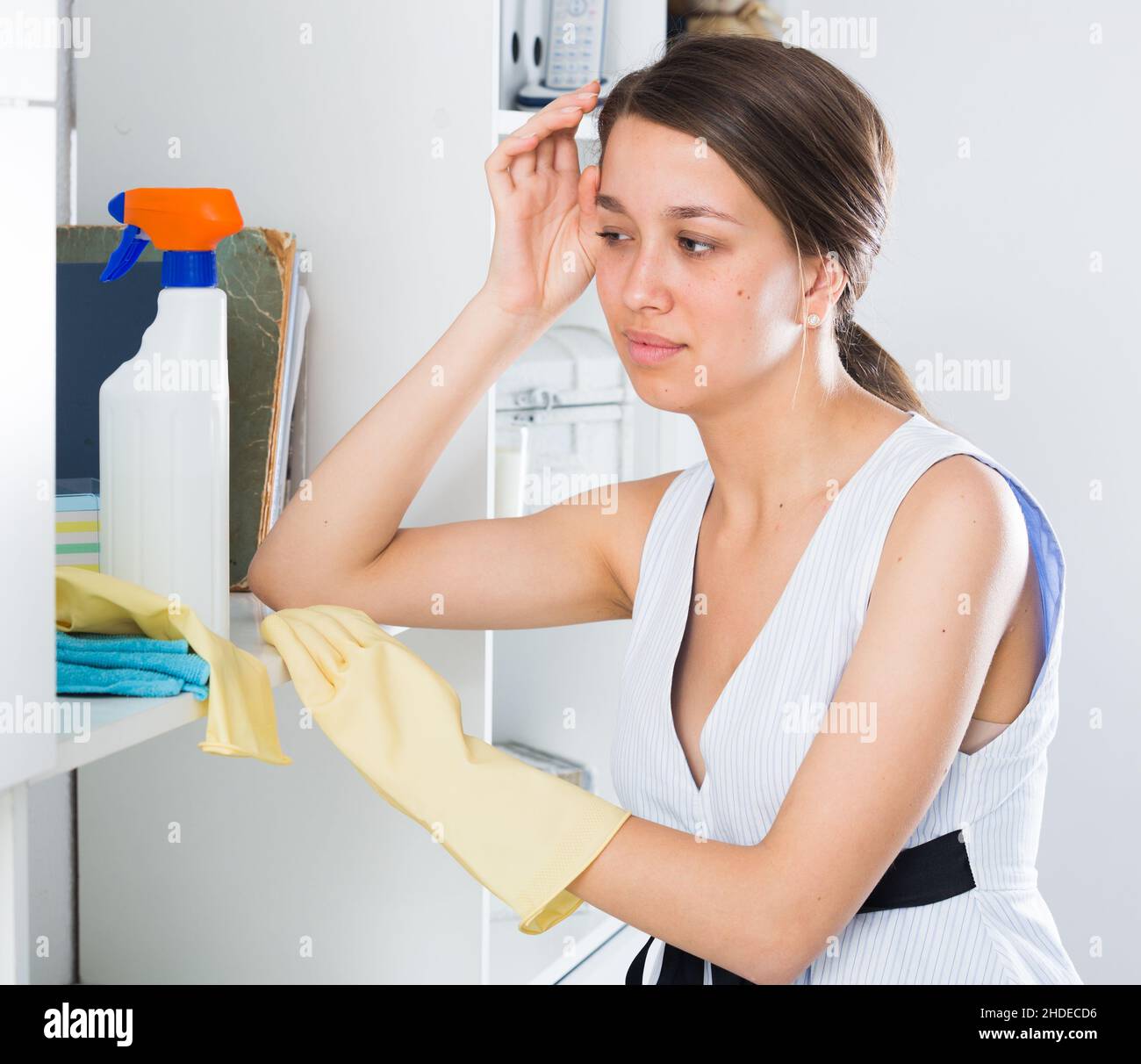 Girl is resting after cleaning Stock Photo - Alamy