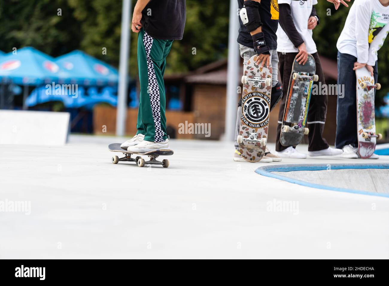 Skateboarder performs a trick in the city Stock Photo - Alamy