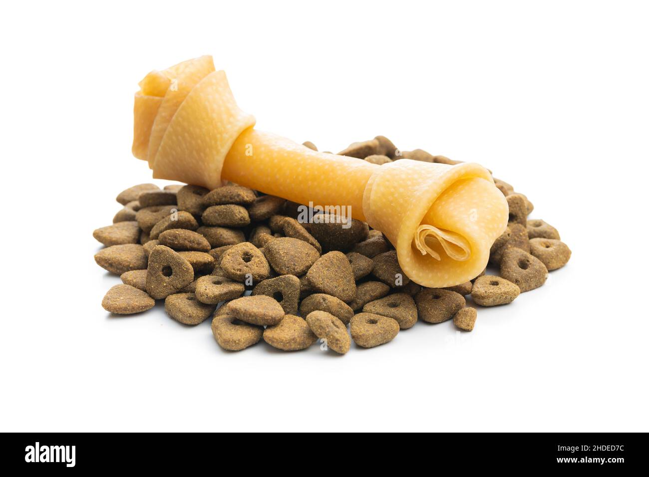 Delicacy for dogs. Chewing bone and dried food for dog isolated on ...