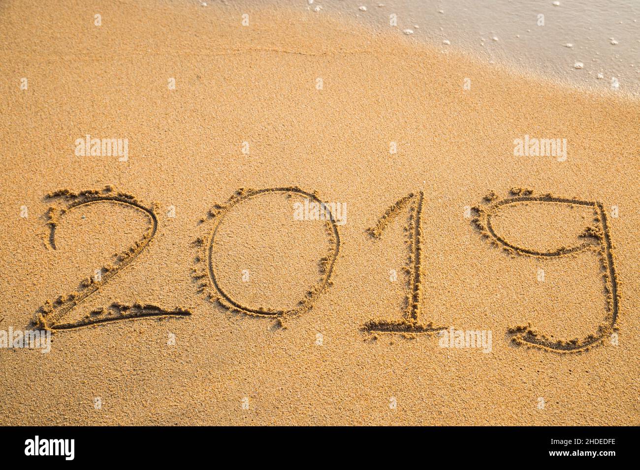 Abstract message Year 2019 written on beach sand background Stock Photo ...