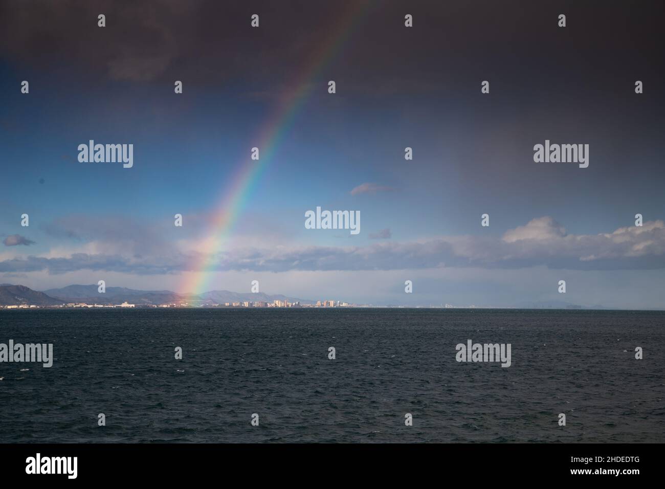rainbow over the sea sky clearing after storm Stock Photo - Alamy