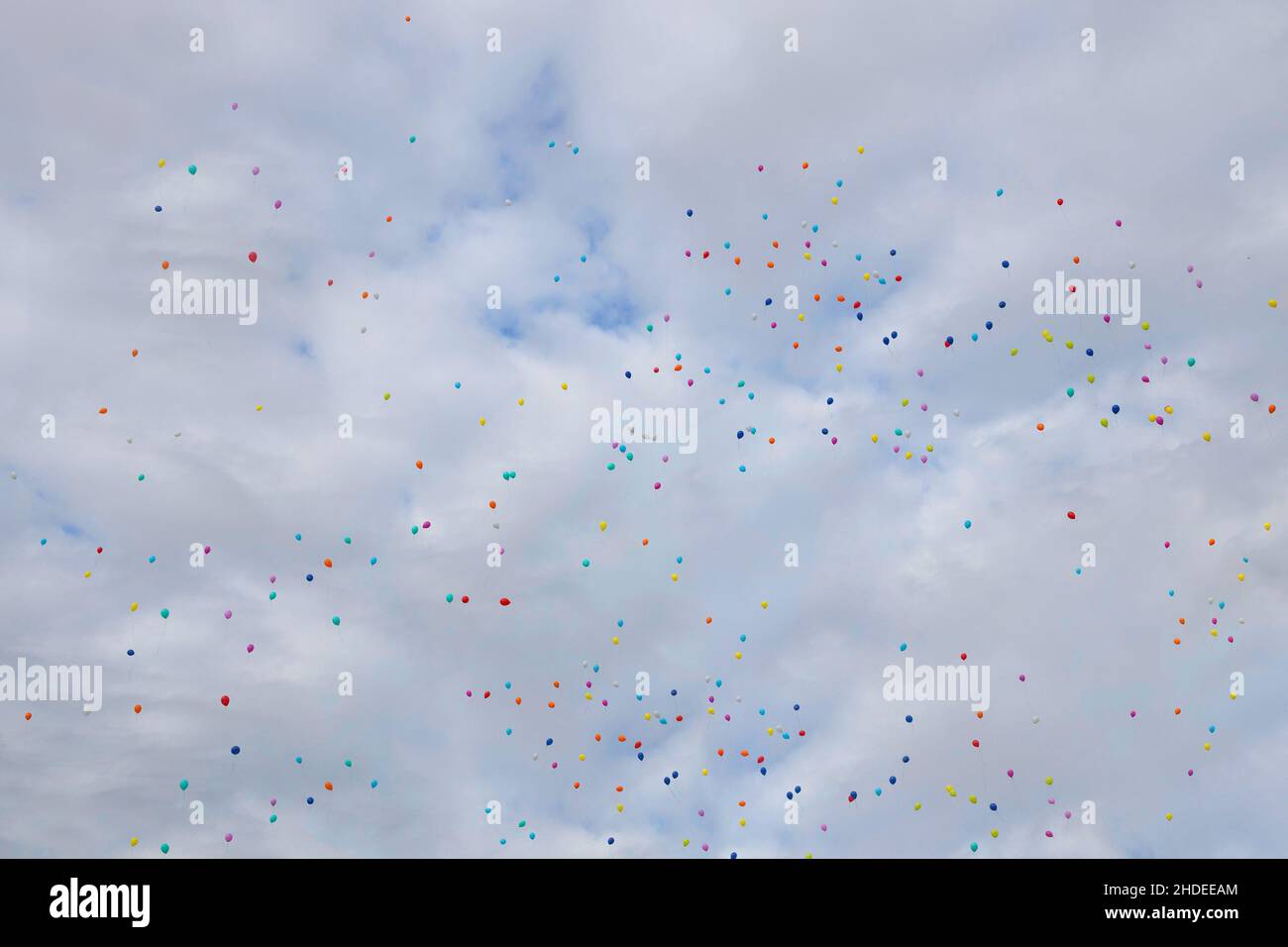 Numerous balloons flying through the air-numbers, contagion, concept ...