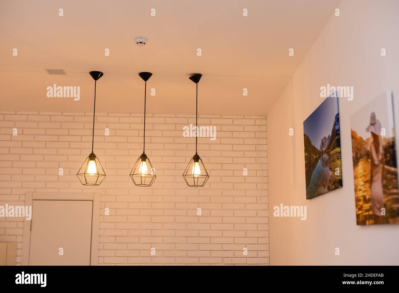 Vintage glowing light bulbs. Three hanging retro incandescent lamps ...