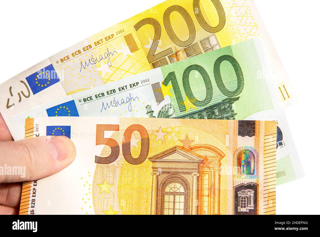 Banknotes of Euro currency in hand on white background. European paper ...