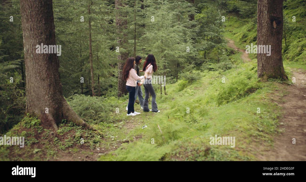 Girls in the forest spending time together Stock Photo - Alamy