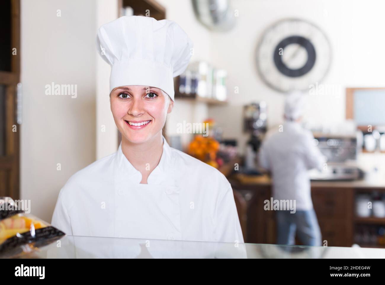 Bakery female worker with delicious pies and rolls on counter Stock ...
