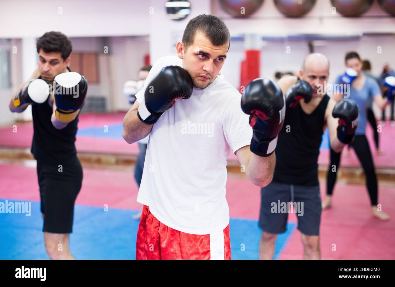 Portrait of men of different ages training Stock Photo - Alamy