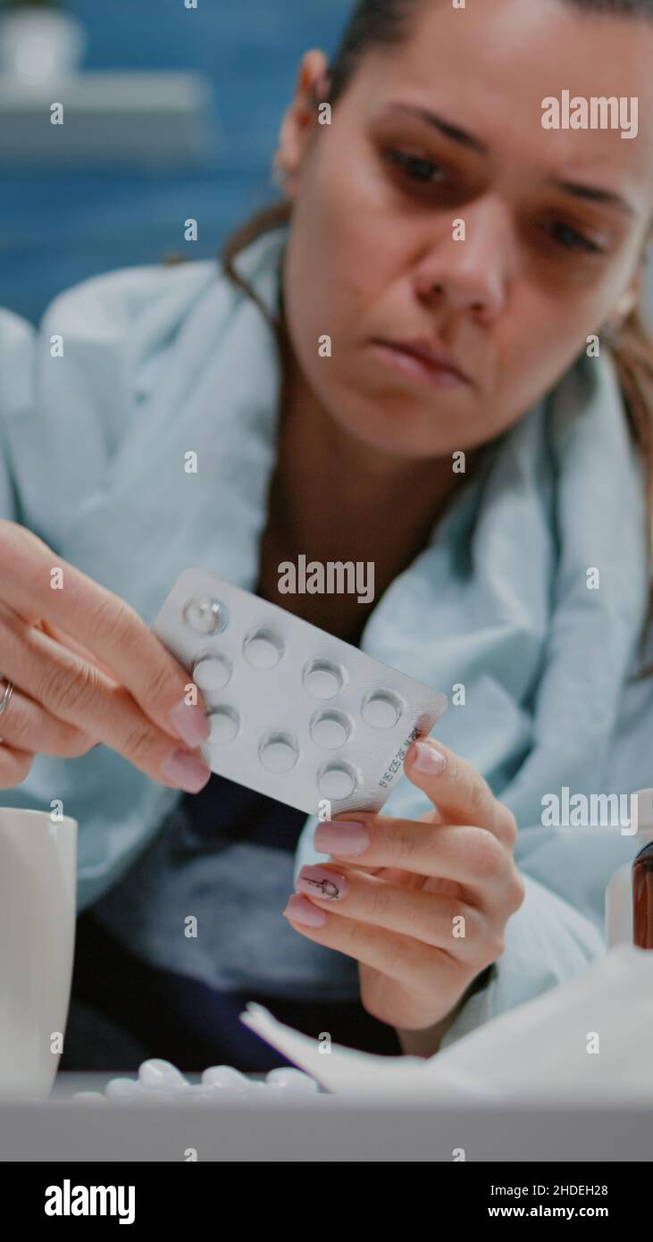 Woman cold looking tablets capsules hi-res stock photography and images ...