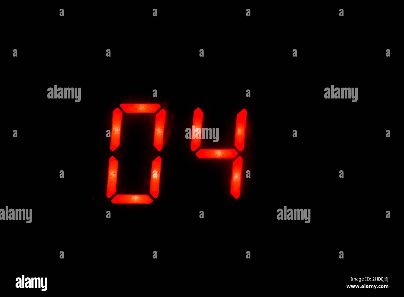 Old digital clock red number on black background Stock Photo - Alamy