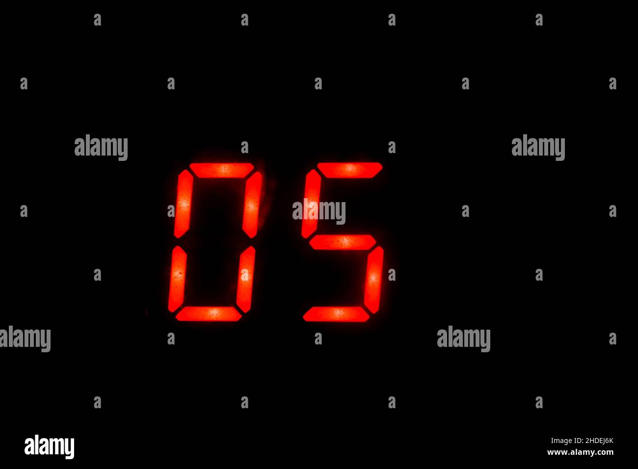 Old digital clock red number on black background Stock Photo - Alamy