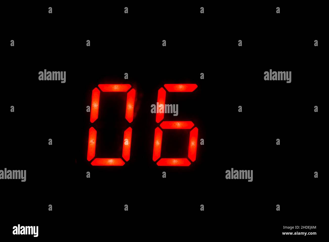 Old digital clock red number on black background Stock Photo - Alamy