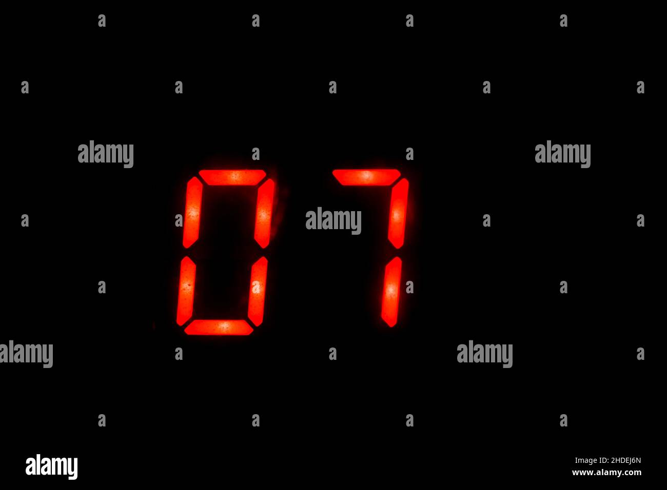 Old digital clock red number on black background Stock Photo - Alamy