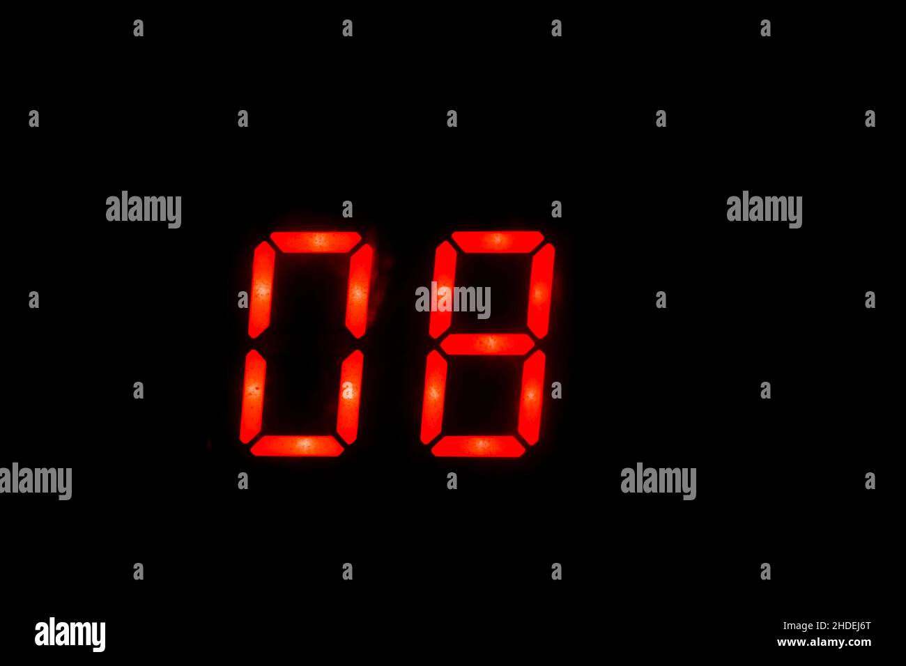 Old digital clock red number on black background Stock Photo - Alamy