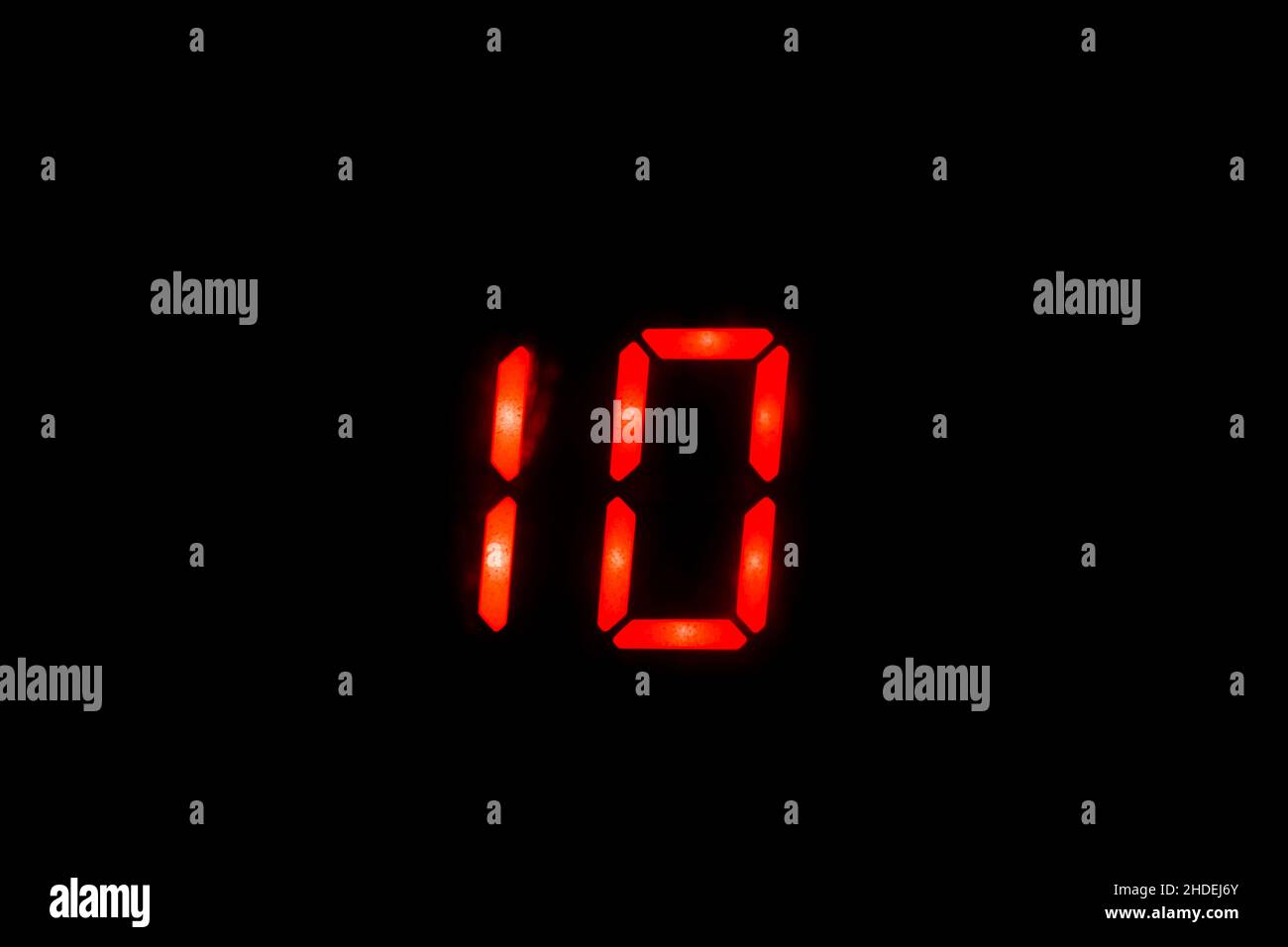 Old digital clock red number on black background Stock Photo - Alamy