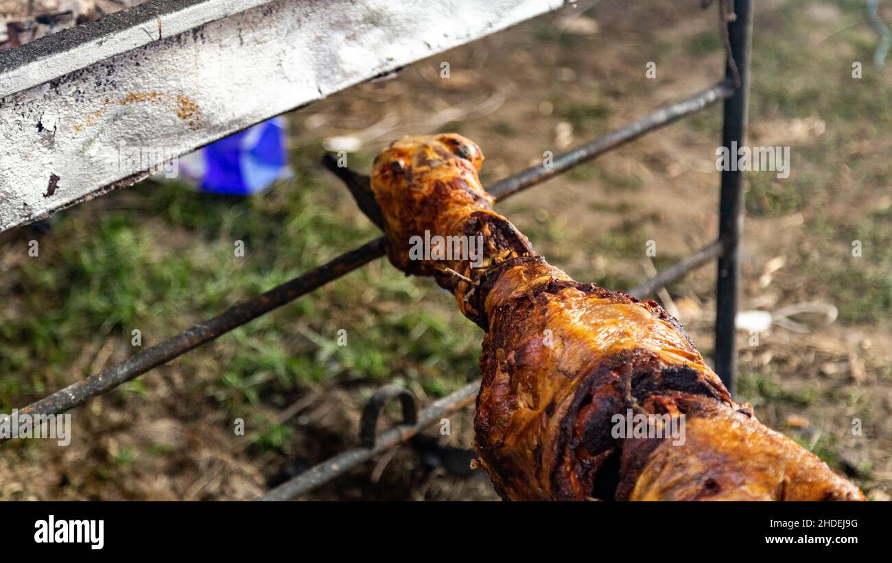 Whole sheep roasting on a spit Stock Photo - Alamy