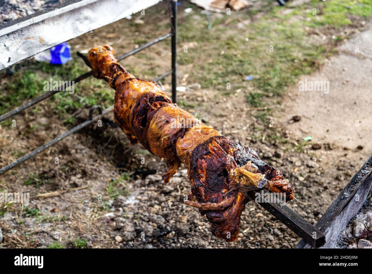 Whole sheep roasting on a spit Stock Photo - Alamy