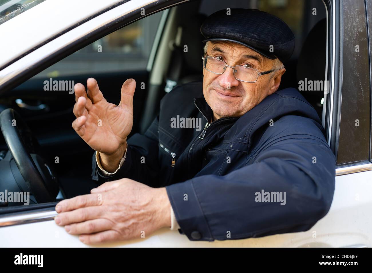 Elderly person driving a car. elderly man in a car Stock Photo - Alamy