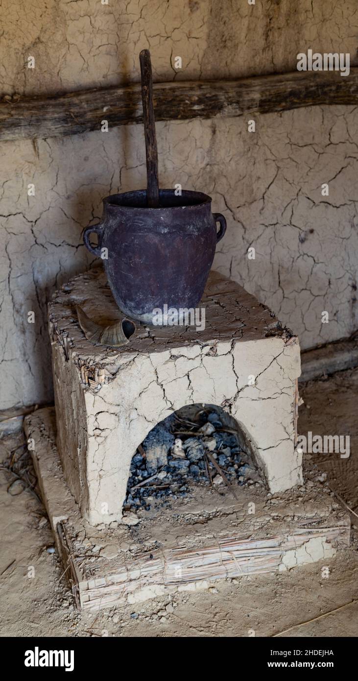 A fireplace in a medieval house with a pot Stock Photo - Alamy