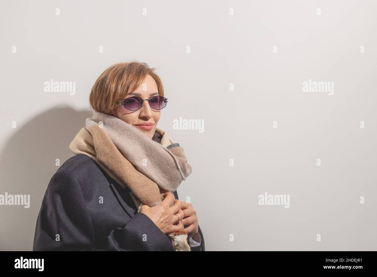 Beautiful baby boomer woman of middle age in sunglasses smile and ...