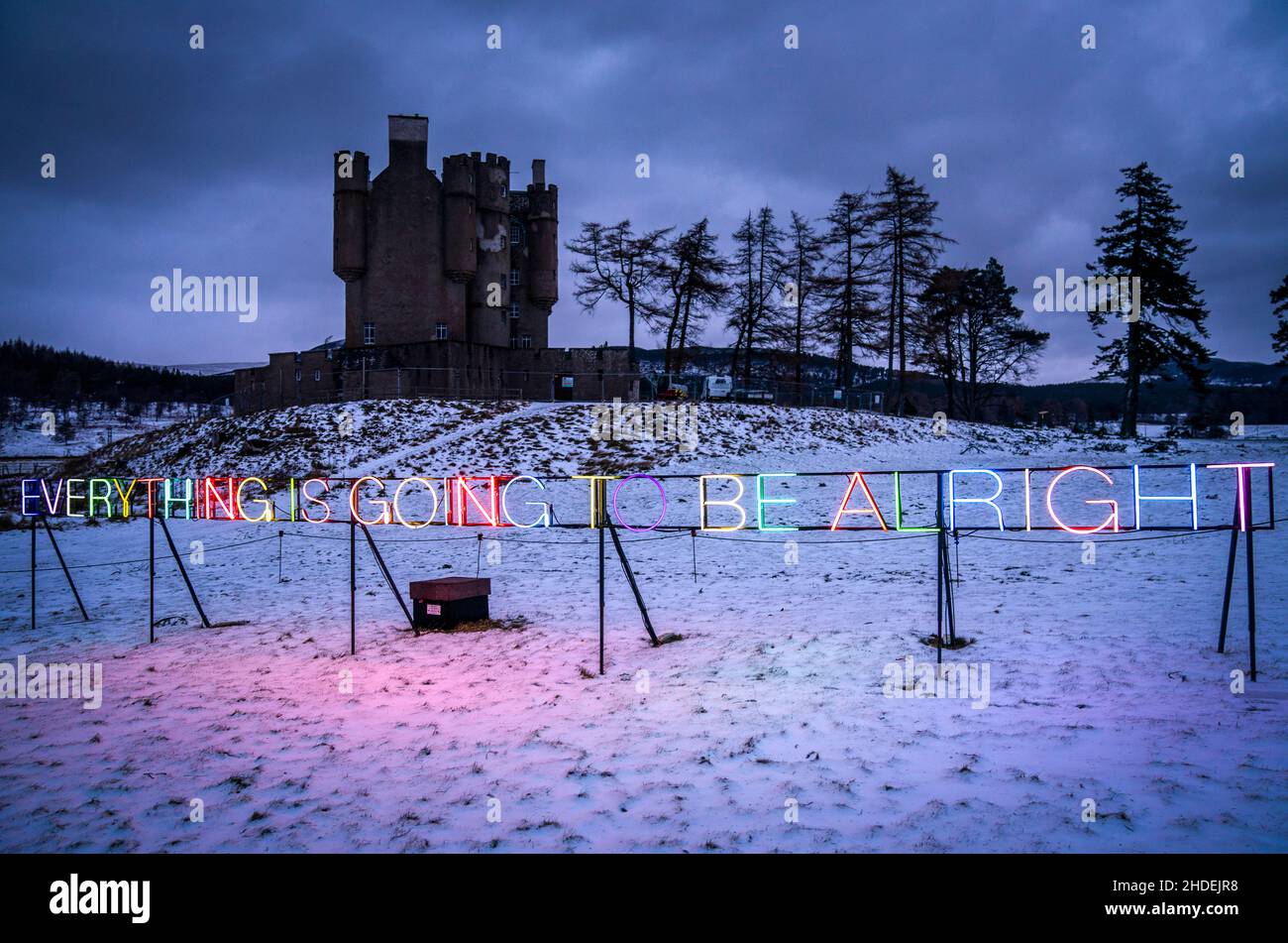 A multi-coloured neon sign that reads 'Everything Is Going To Be ...