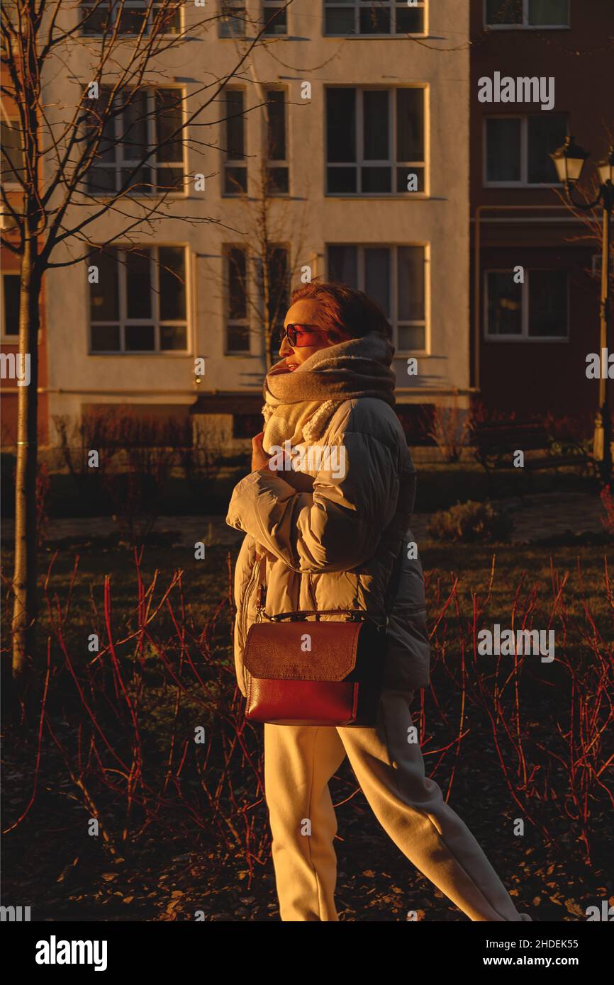 Beautiful baby boomer woman of middle age in sunglasses and stylish ...