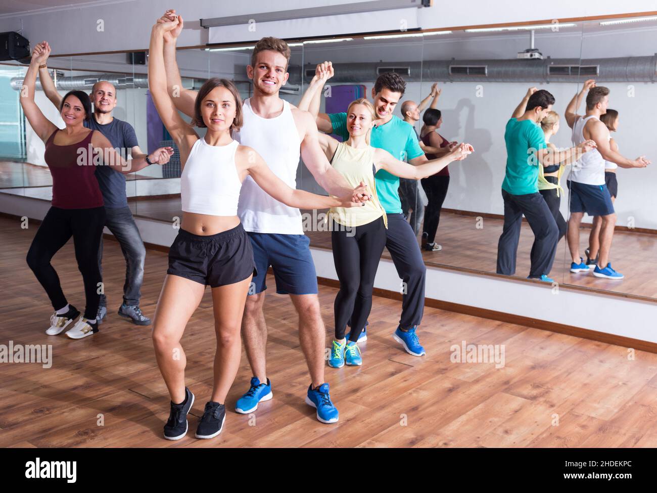 girls and men learning salsa Stock Photo - Alamy