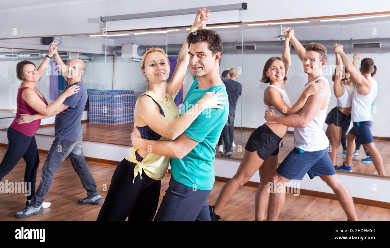 Men and women dancing salsa o bachata Stock Photo - Alamy