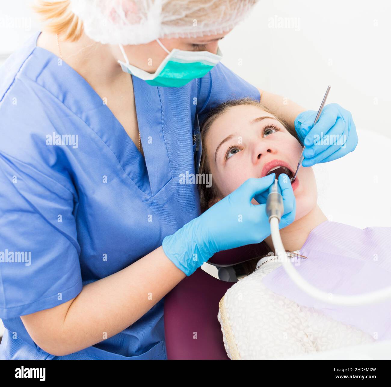 Girl getting dental treatment Stock Photo - Alamy