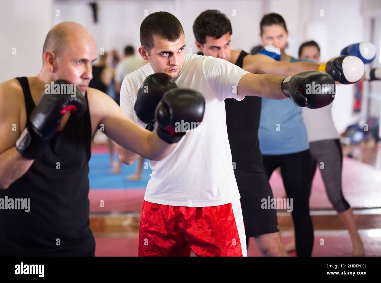 Glad people practicing boxing punches Stock Photo - Alamy