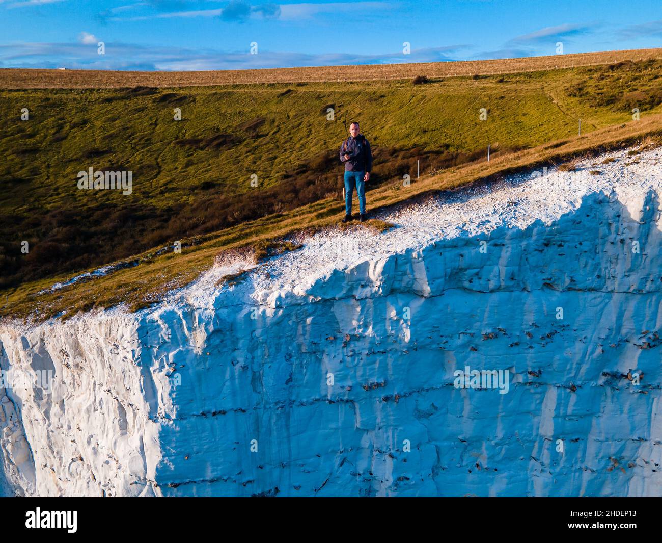 Person standing on cliff edge hi-res stock photography and images - Alamy