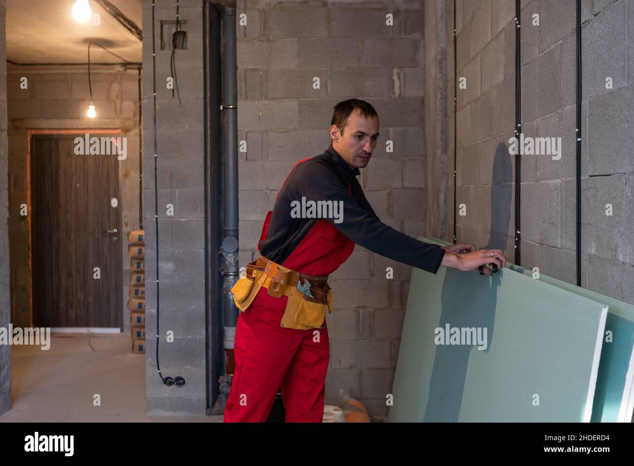 Builder handyman with construction tools. House renovation background ...