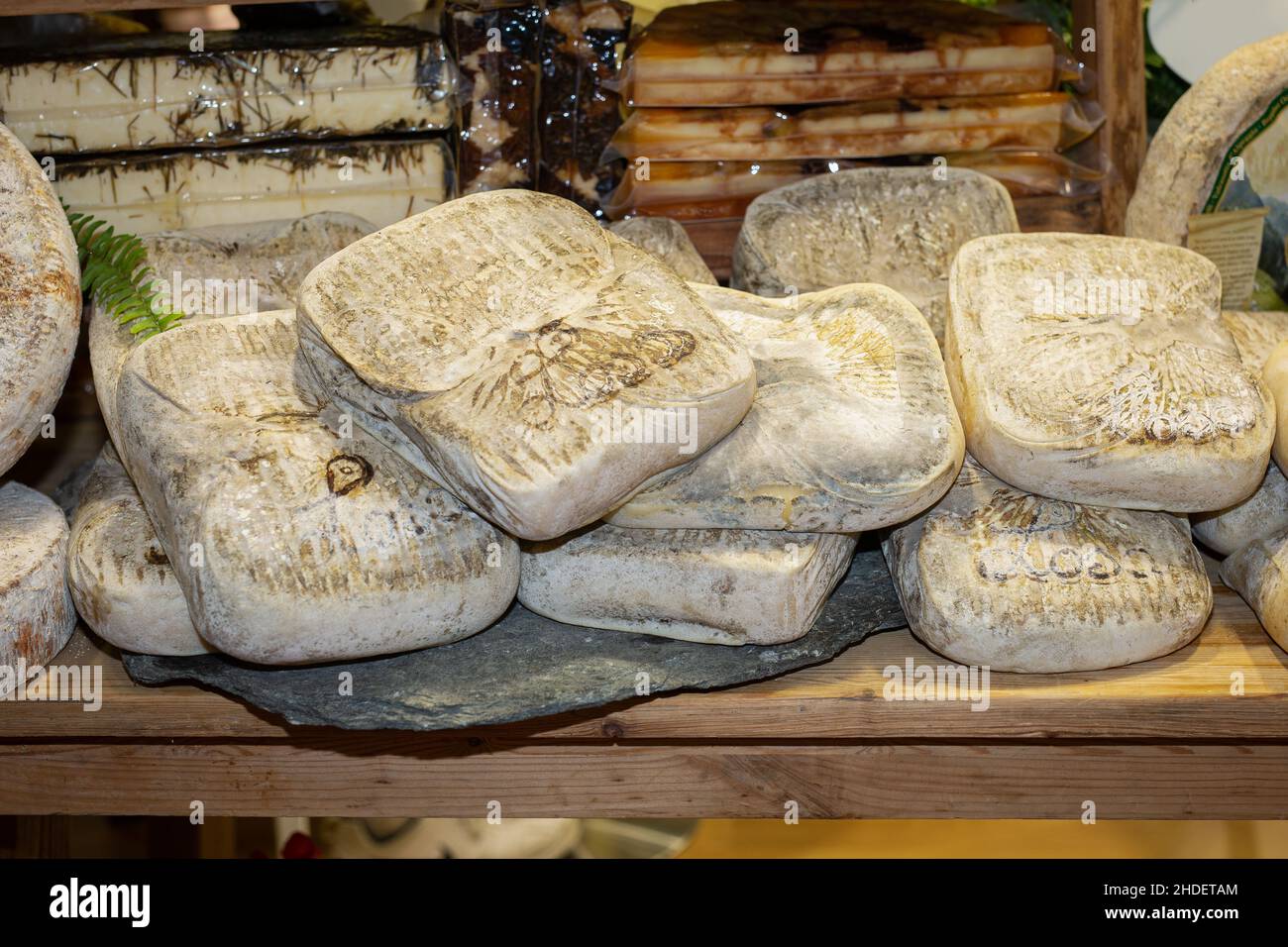 Matured Cheese Shapes Displayed on Wooden Table Stock Photo - Alamy