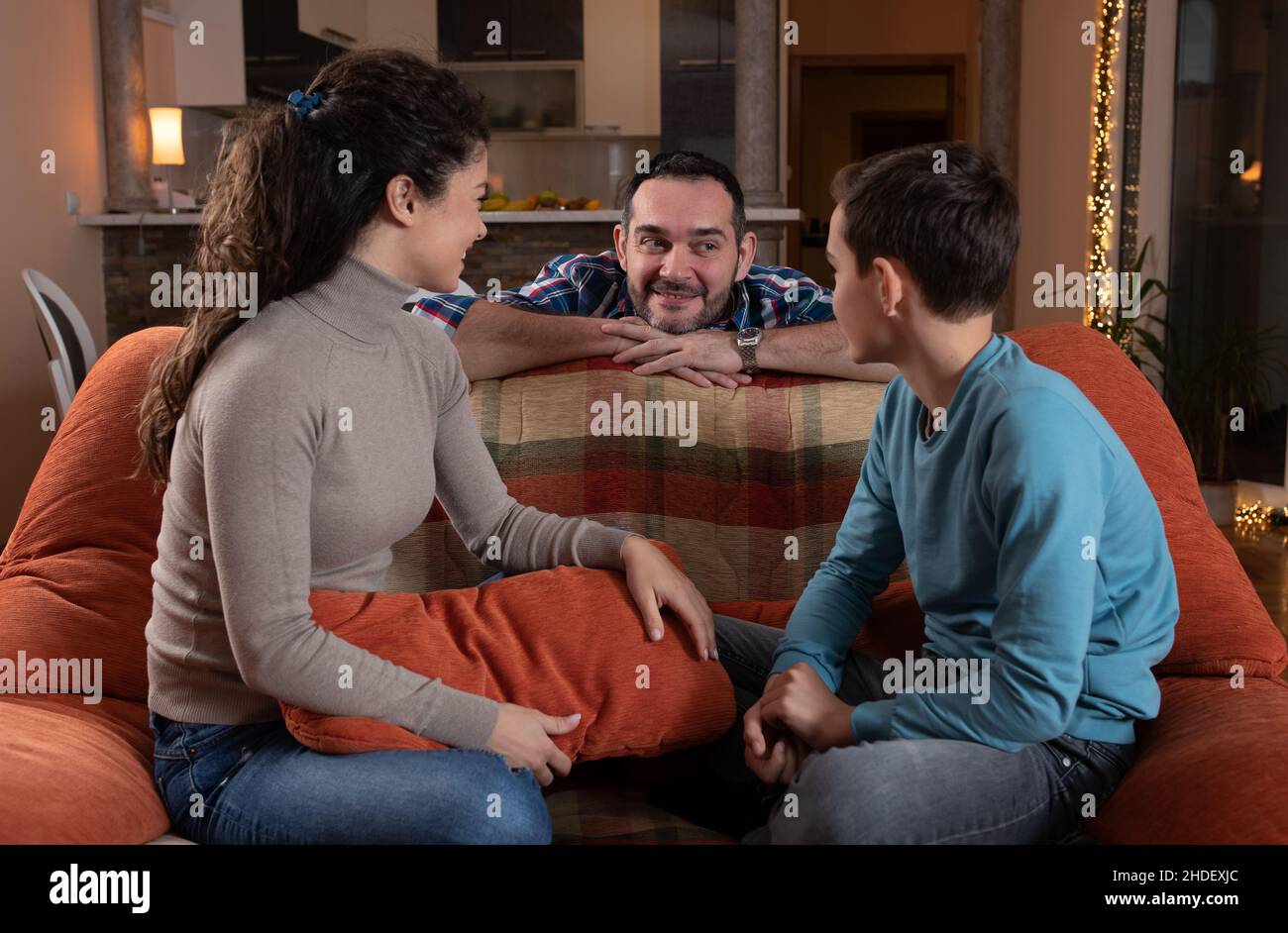 Teen father son talking sofa hi-res stock photography and images - Alamy