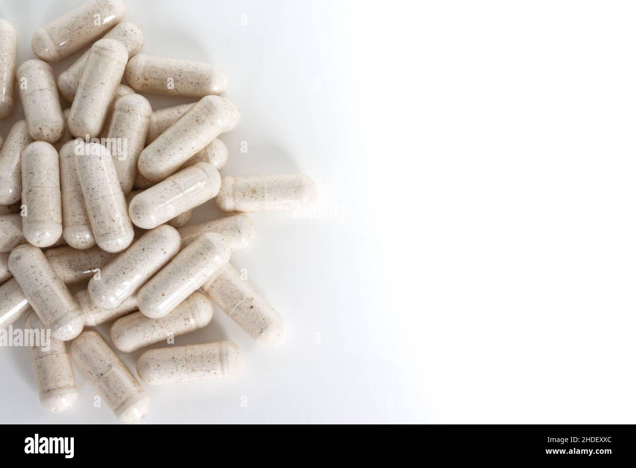 Front view detail of white vitamin supplements isolated on a white ...